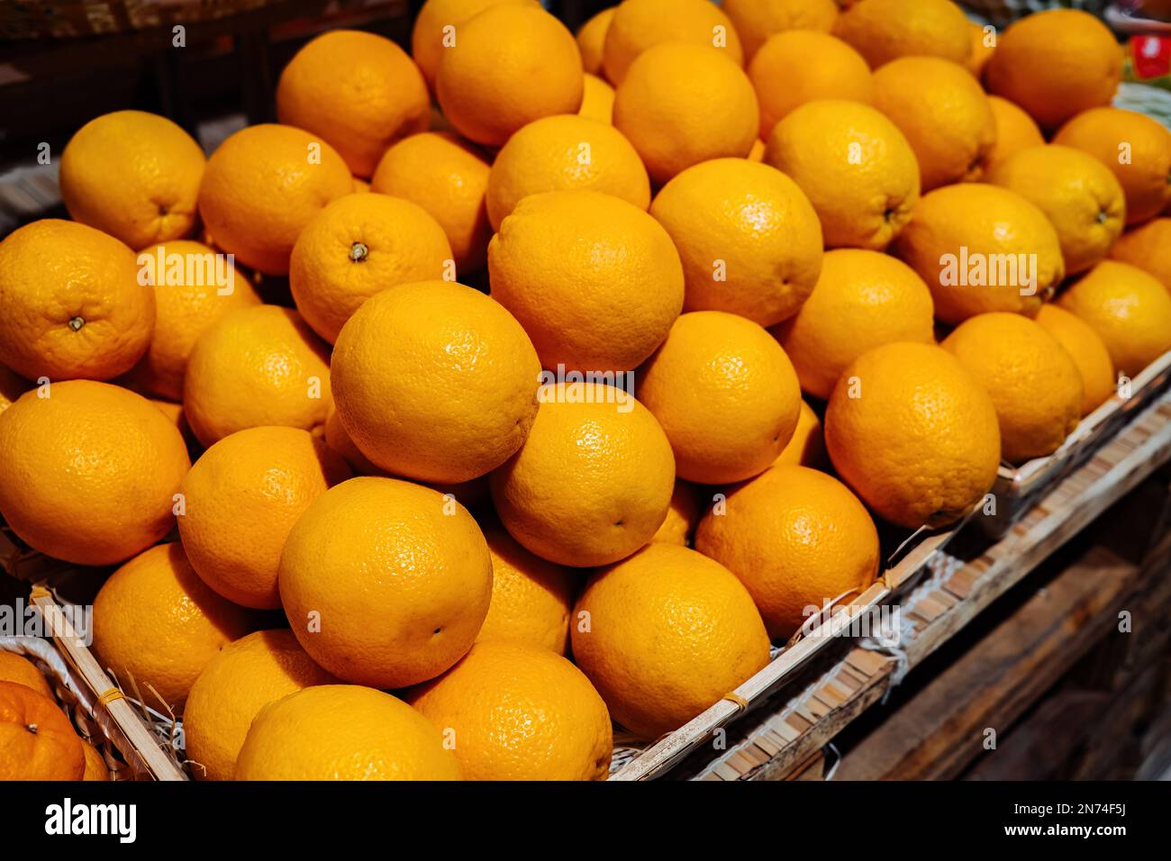 Bunch of orange in supermarket or market. Sale of healthy product ...