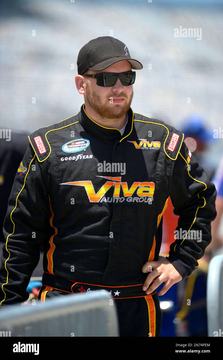 Jamie Dick walks down pit road during qualifying for the NASCAR ...