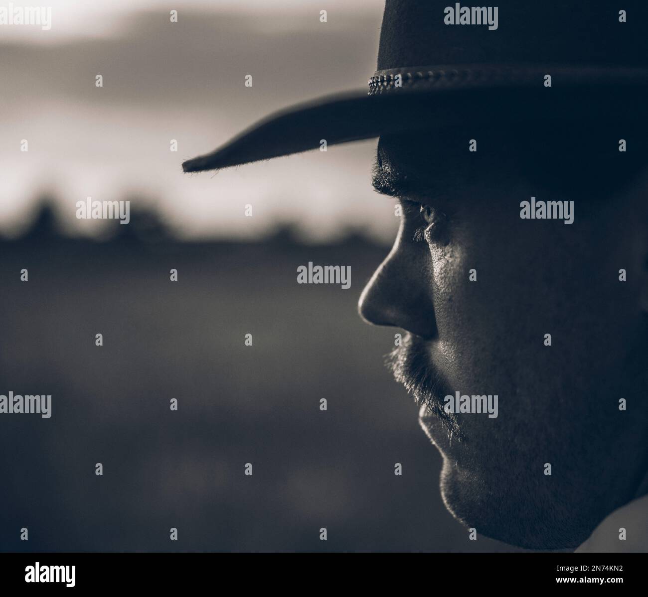 Man with cowboy hat, portrait, sideways Stock Photo - Alamy