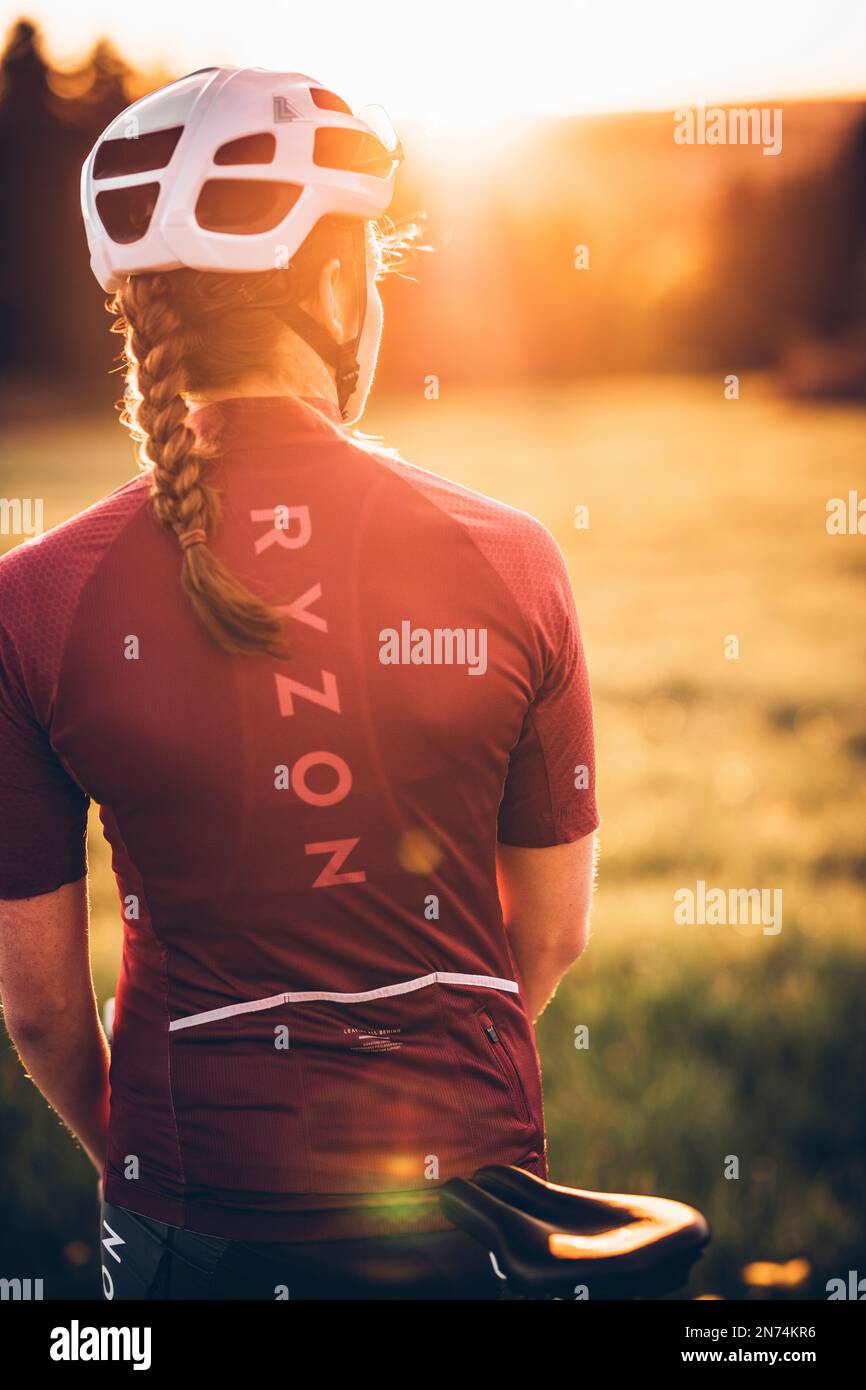 Professional triathlete on her road bike, time trial bike round ...