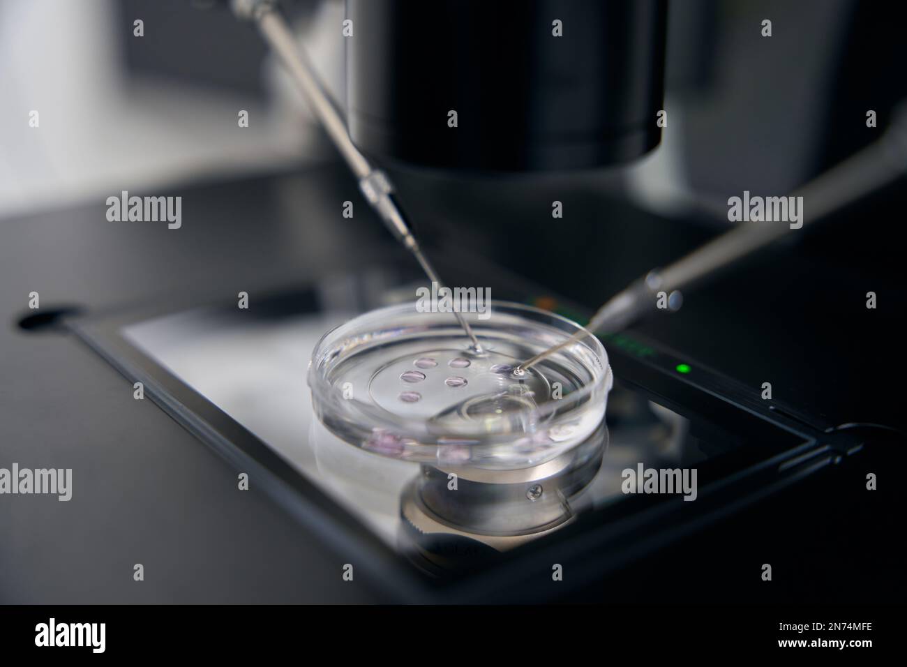 Working with biomaterial using a micromanipulator in a specialized ...