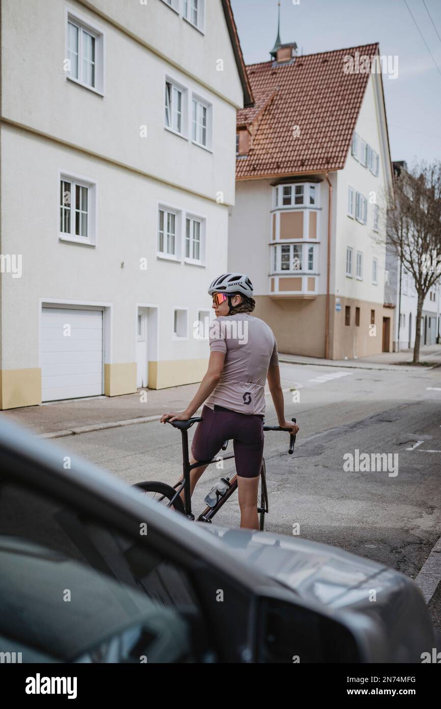 Professional triathlete with her road bike on a training lap in Black ...