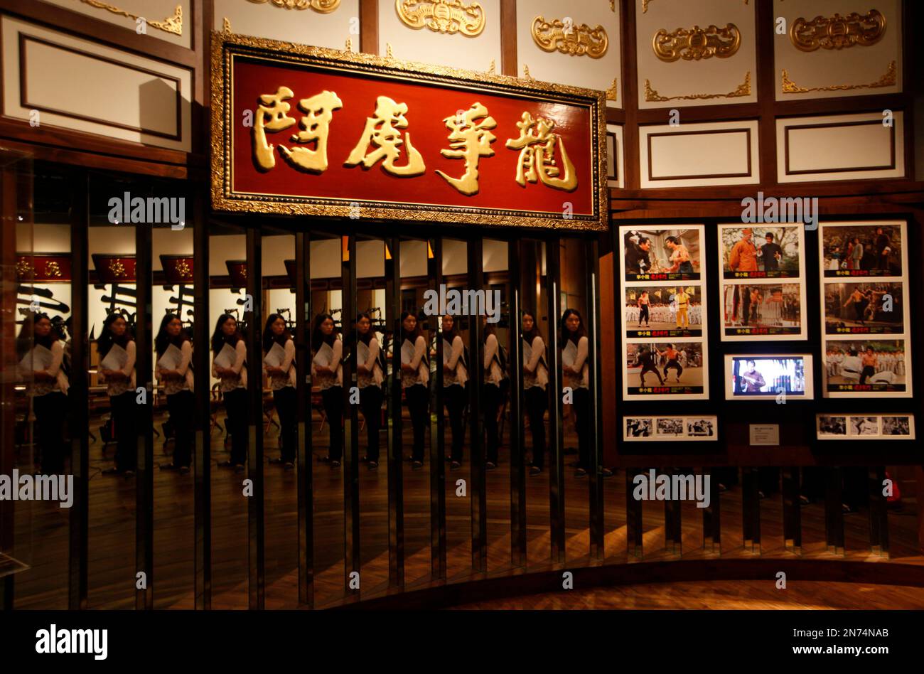 Reflection of a reporter is casted in the mirrors at the late Kung Fu ...