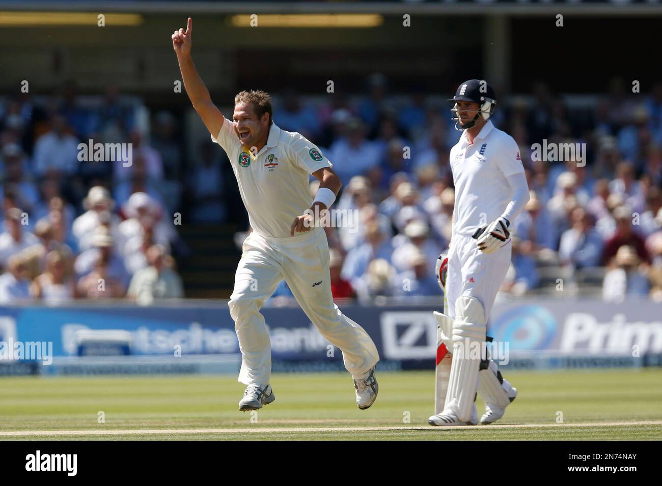 Australia's bowler Ryan Harris, left, celebrates the wicket of England ...