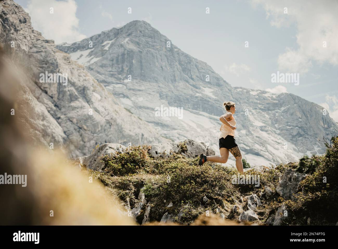Woman on a great trail running around the Schachenhaus of King Ludwig ...