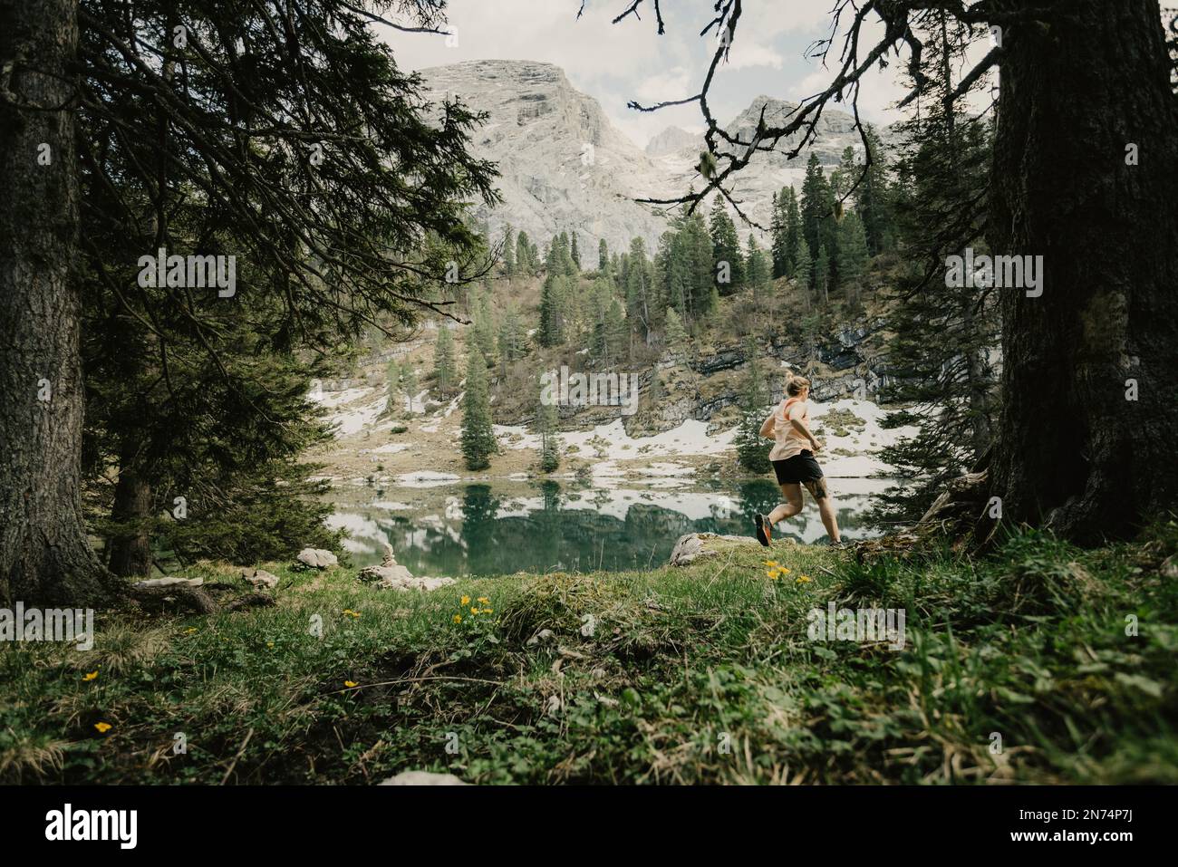 Woman on a great trail running around the Schachenhaus of King Ludwig ...