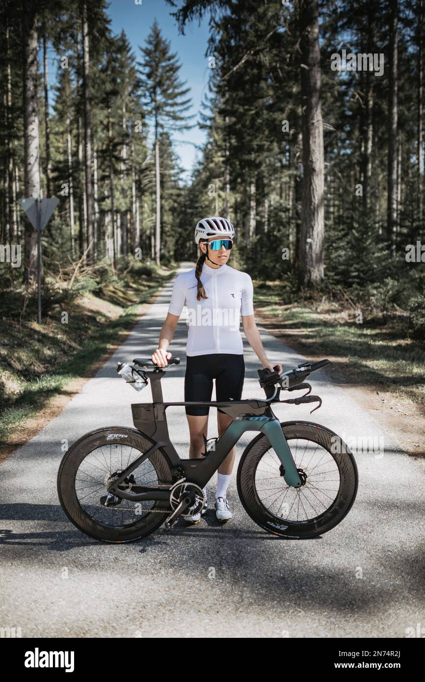 Professional triathlete with her time trial bike / Time Trial Bike in ...