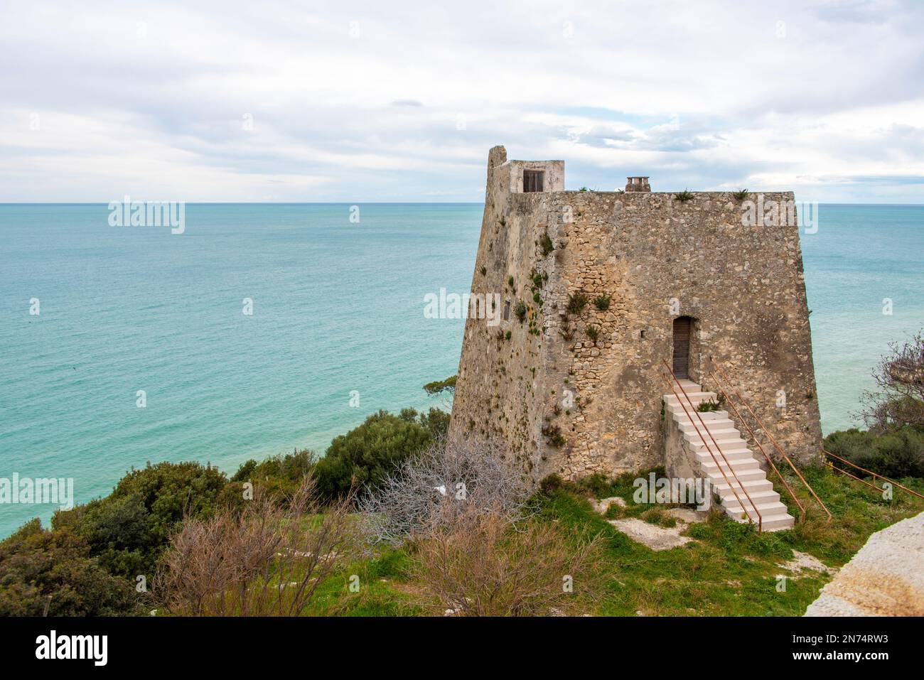 A saracen signal tower at the coast of gargano hi-res stock photography ...