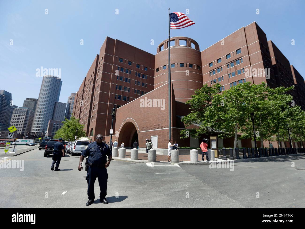 A federal police officer stands guard in the street just before ...
