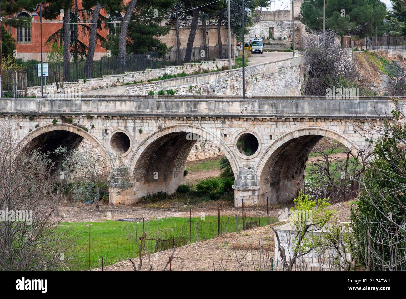 Beautiful old bridge with three arches in downtown bitonto hi-res stock ...