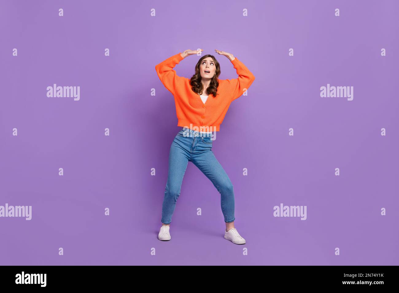 Full length photo of terrified lady catch falling down large object ...