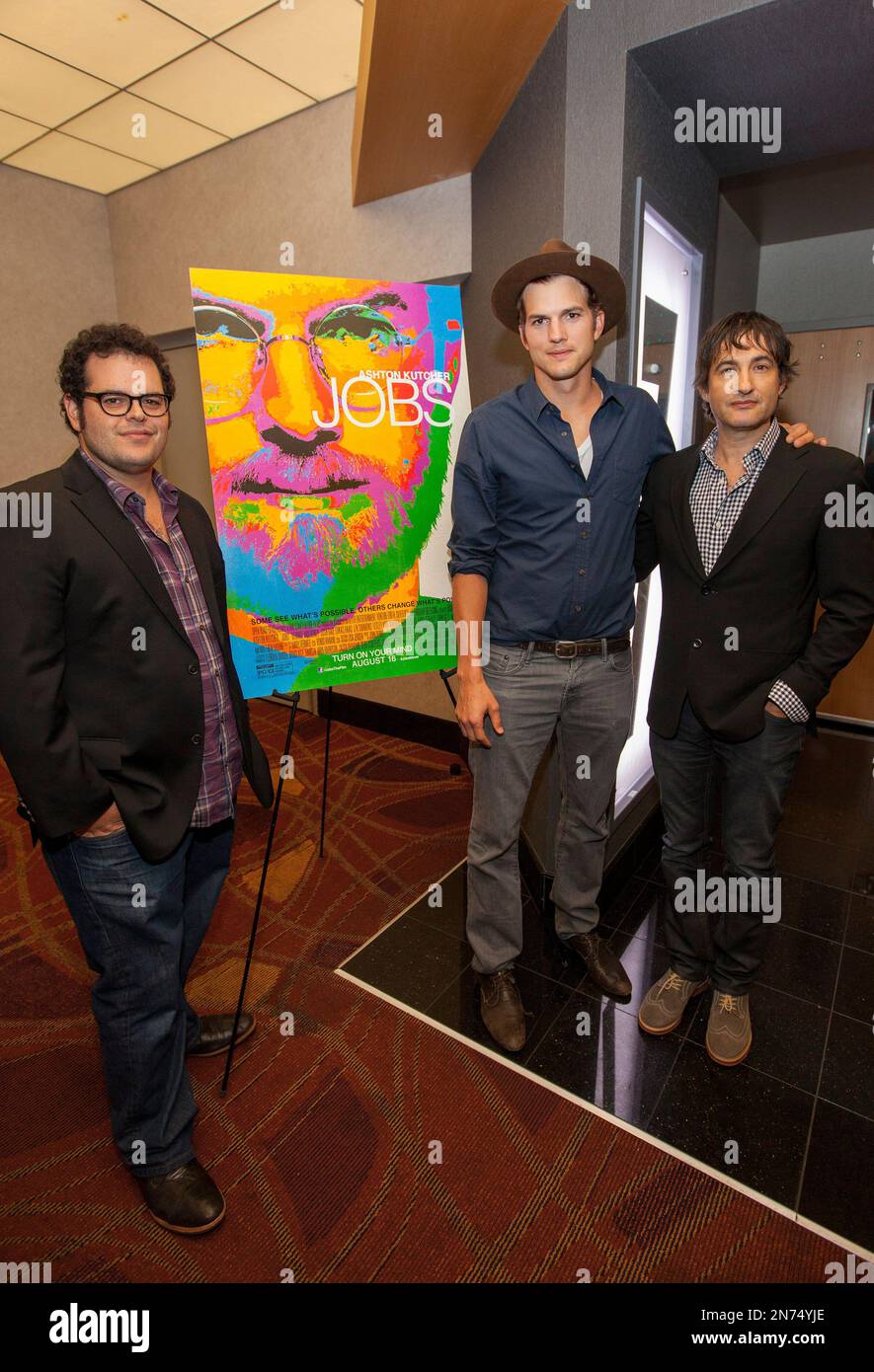 Actors Josh Gad, Ashton Kutcher and director Joshua Michael Stern seen ...