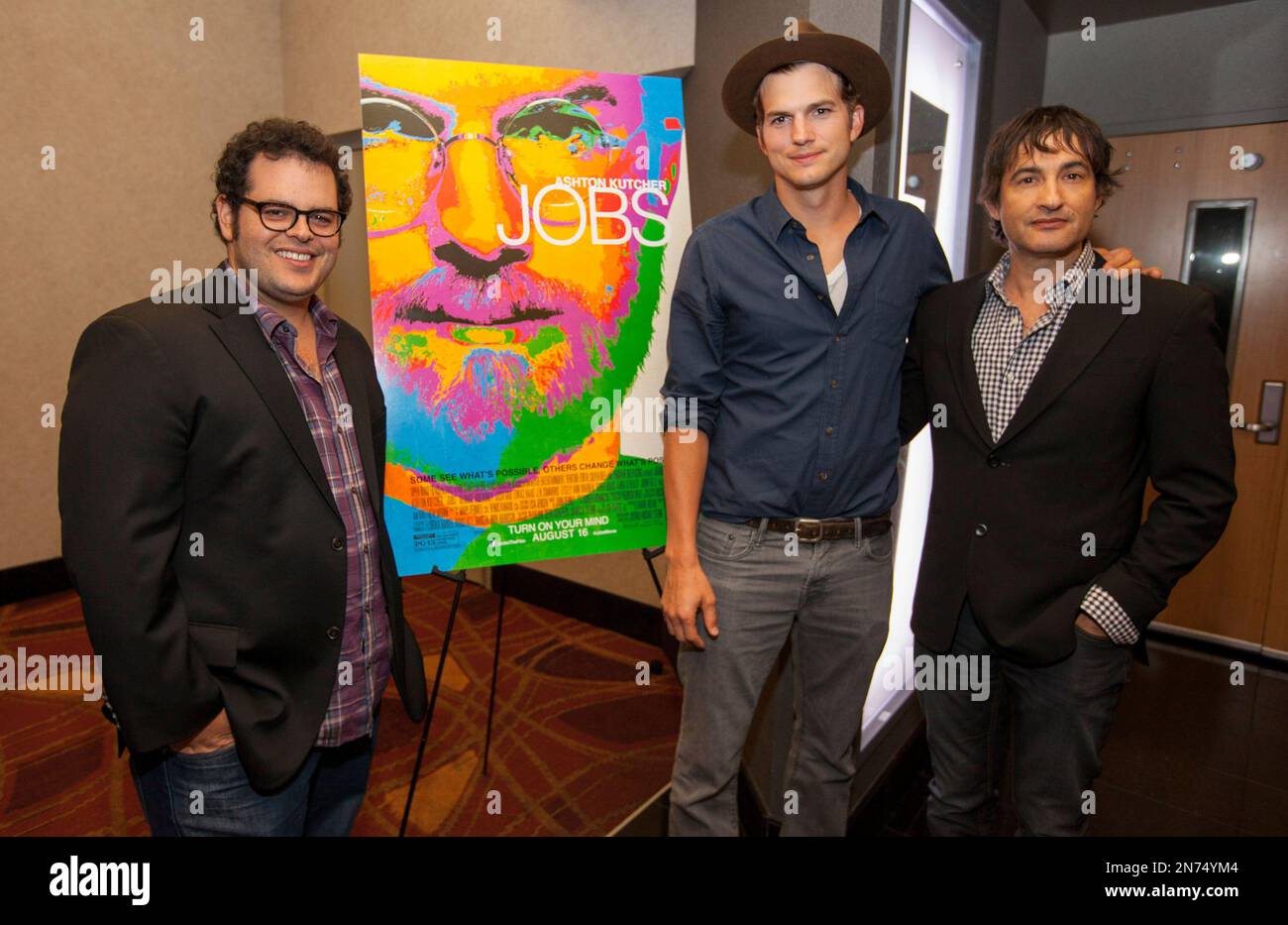 Actors Josh Gad, Ashton Kutcher and director Joshua Michael Stern seen ...