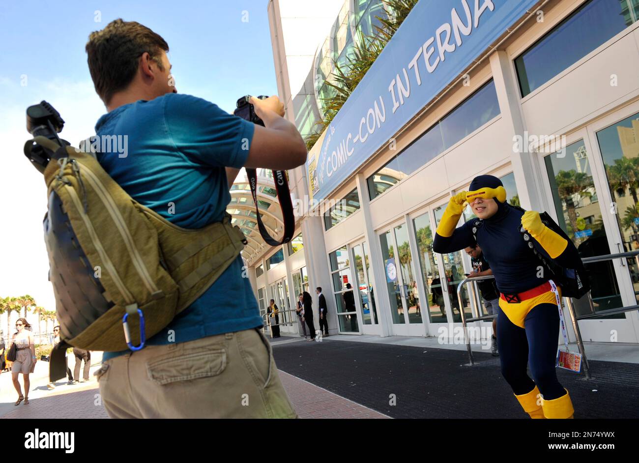 Gene Ross, right, of Chula Vista, Calif., dressed as "Cyclops," poses ...