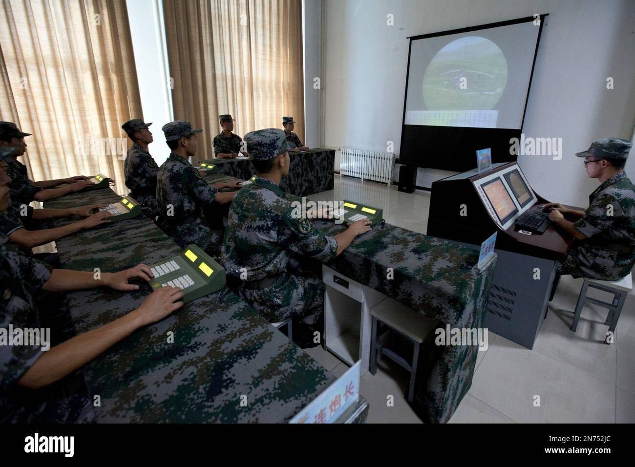 Soldiers train on an artillery simulation system at a base of People's ...