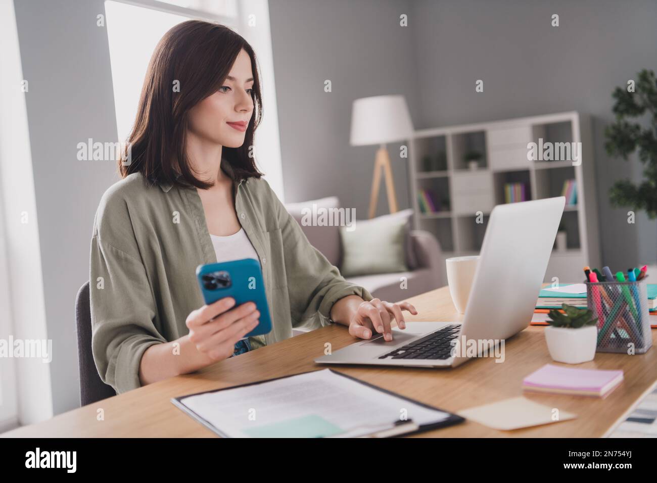 Photo of successful banker serious chief ceo sitting table using ...