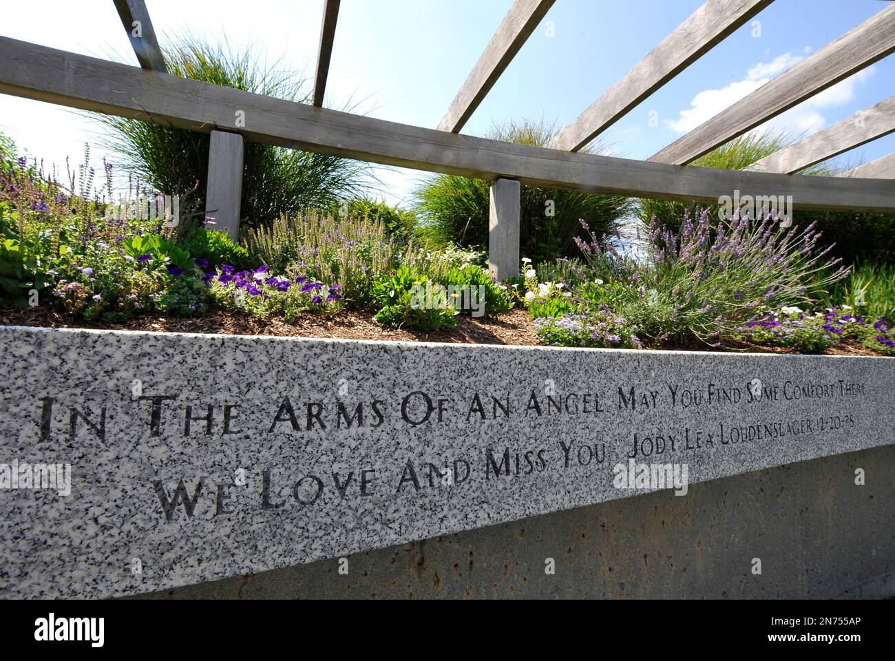 A tribute to a loved one is inscribed one of several memorial stone ...