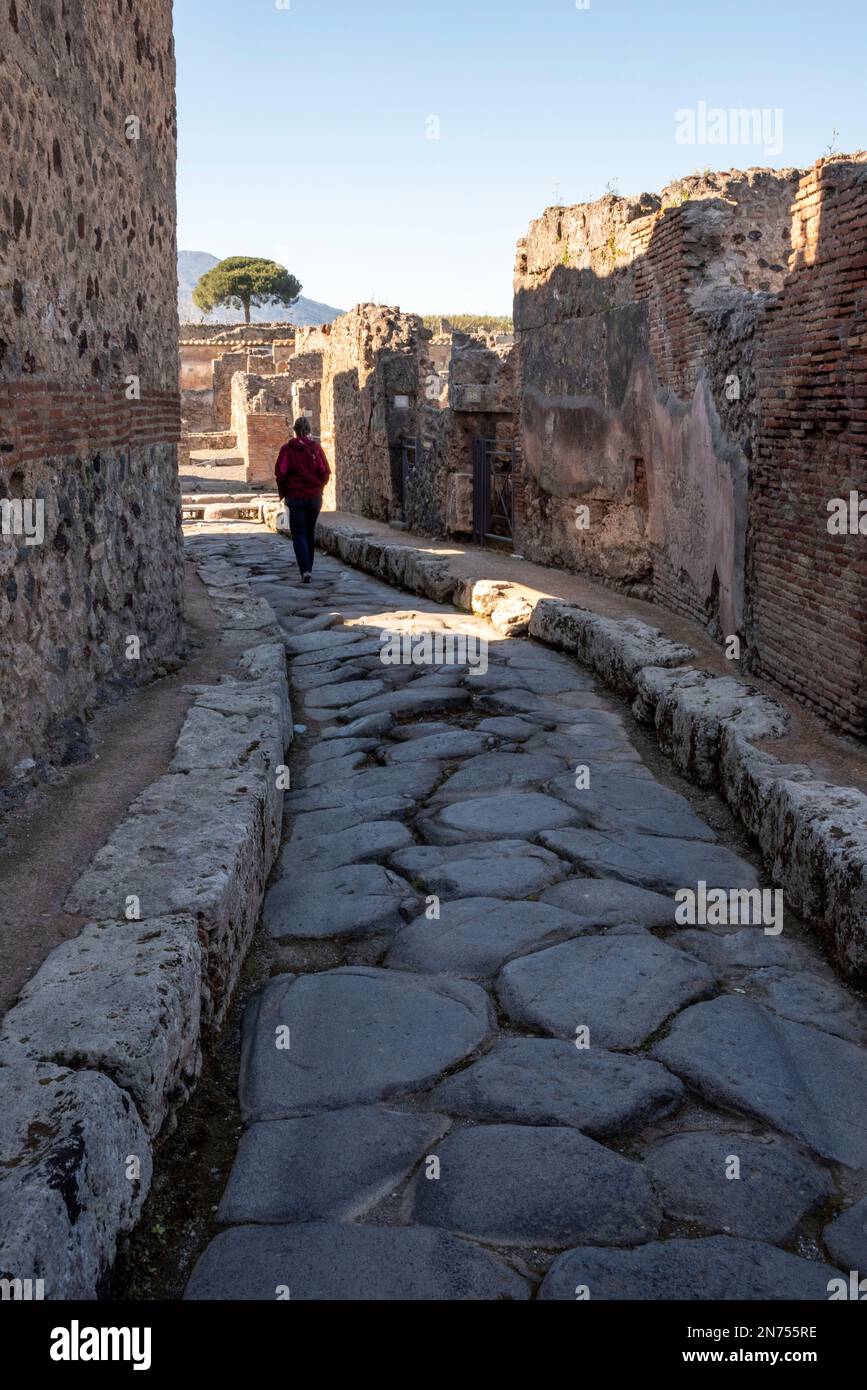 A beautiful typical cobbled street in the ancient city of Pompeii ...