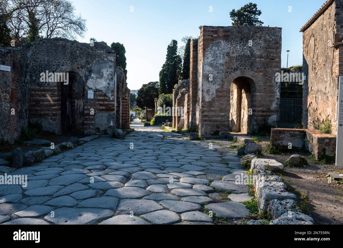 A beautiful typical cobbled street in the ancient city of Pompeii ...