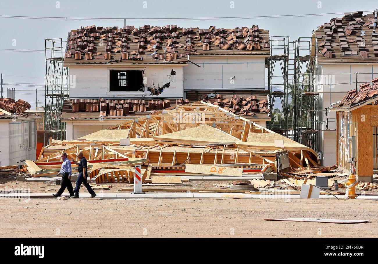 A wind-collapsed house frame is shown Tuesday, July 16, 2013 in the ...