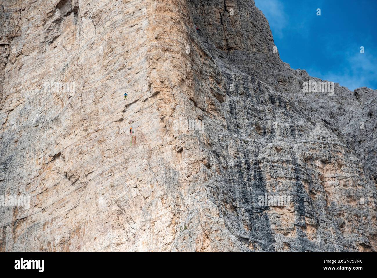 Mountaineers climbing up the 3 Zinnen in the dolomite mountains, South ...