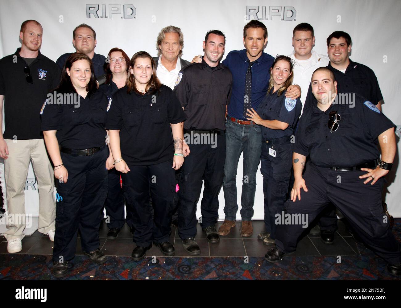 Jeff Bridges and Ryan Reynolds pose with Boston First Responders during ...