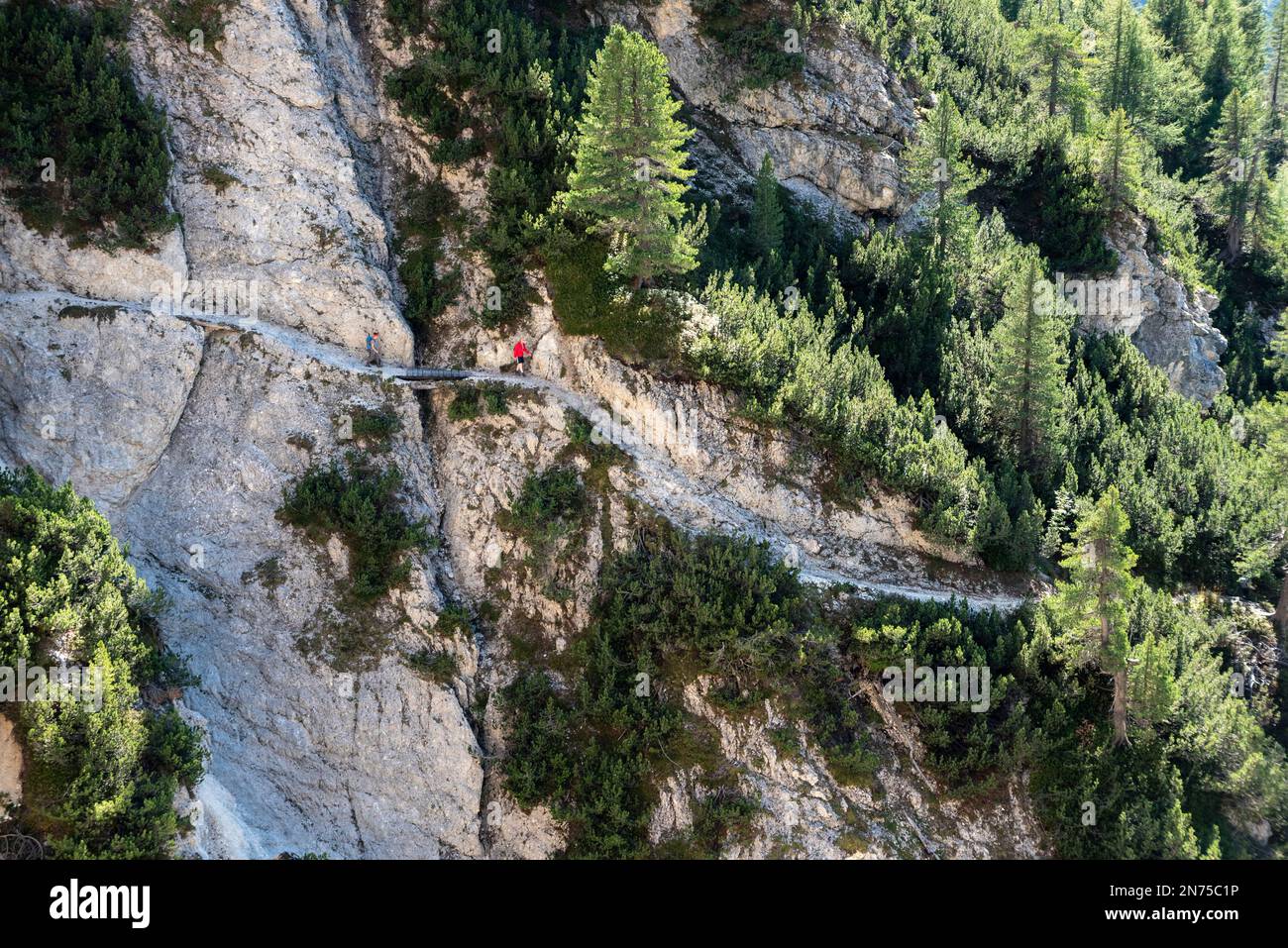 Hiking through fragile limestone rock in the Rienz valley of South ...