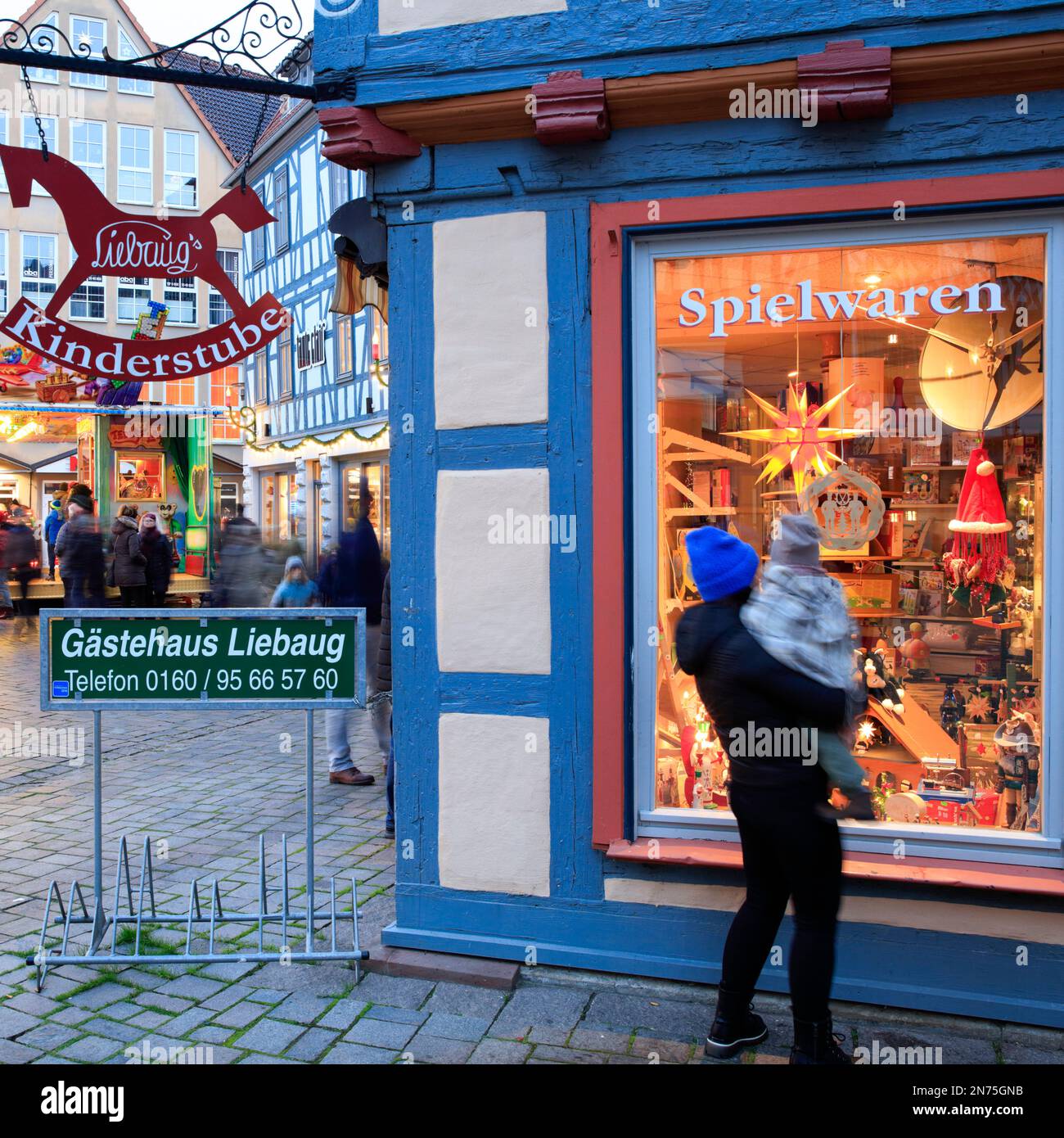 House facade, window, illuminated, woman, child, blue hour, half ...