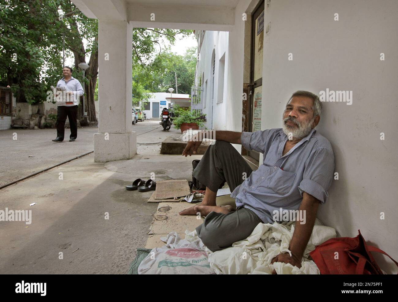 In this Wednesday, July 3, 2013 photo, Jagdish Chand Sharma sits ...