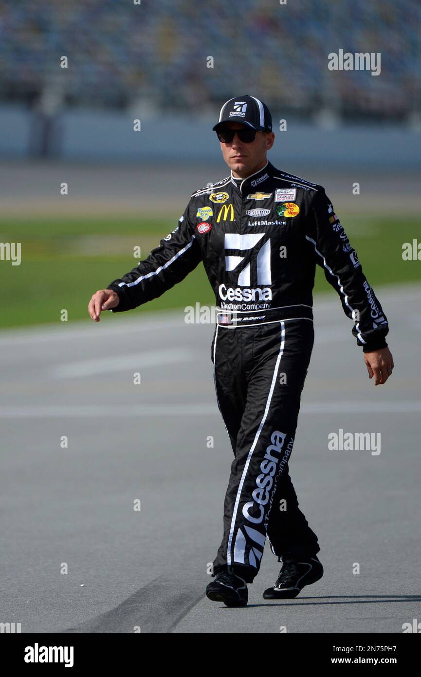 Jamie McMurray walks down pit road during qualifying for the NASCAR ...