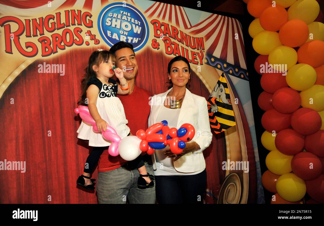 Mario Lopez poses with his wife Courtney Mazza and their daughter Gia ...