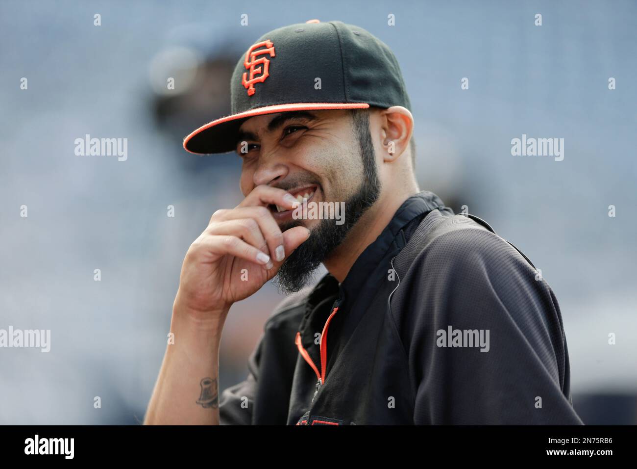 San Francisco Giants relief pitcher Sergio Romo jokes during batting ...