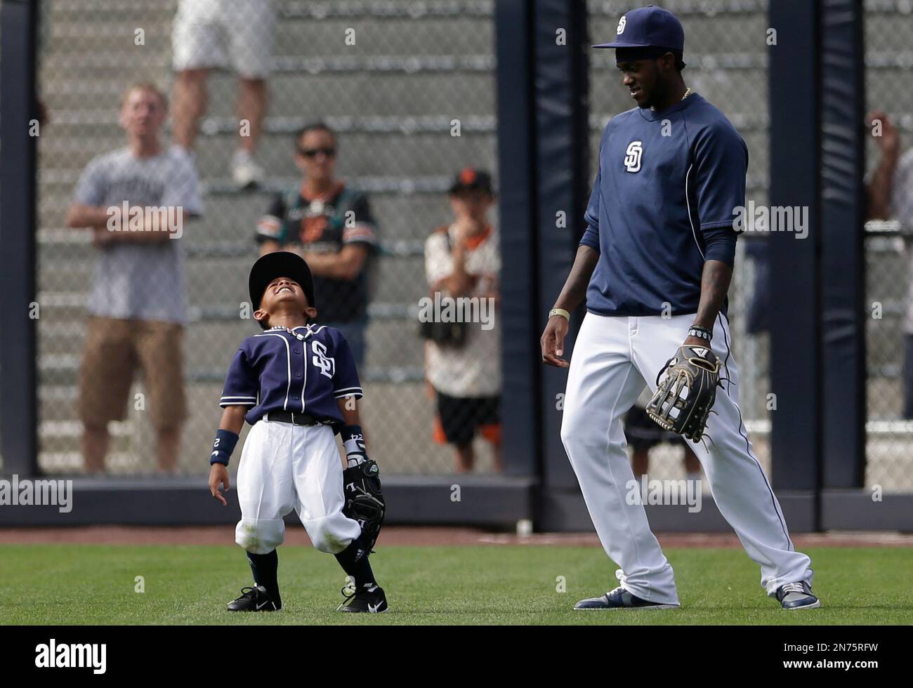 San Diego Padres center fielder Cameron Maybin, right, looks on as his ...