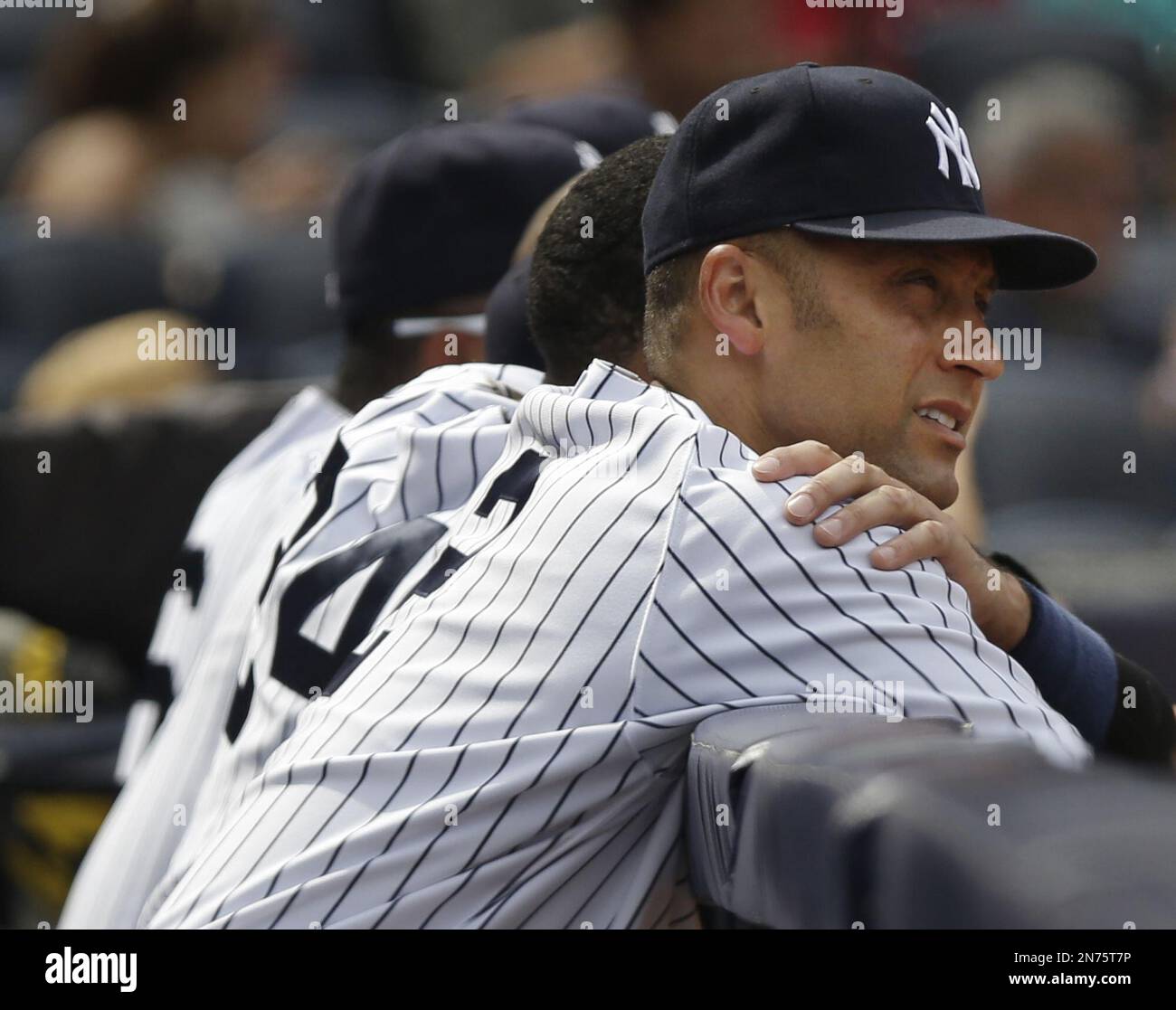 New York Yankees' Derek Jeter looks out of the dugout during the ...