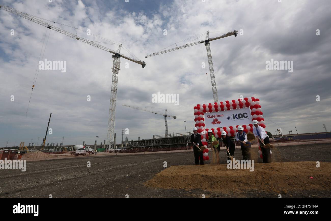 WIth cranes at work in the background, shown from left are Richardson ...