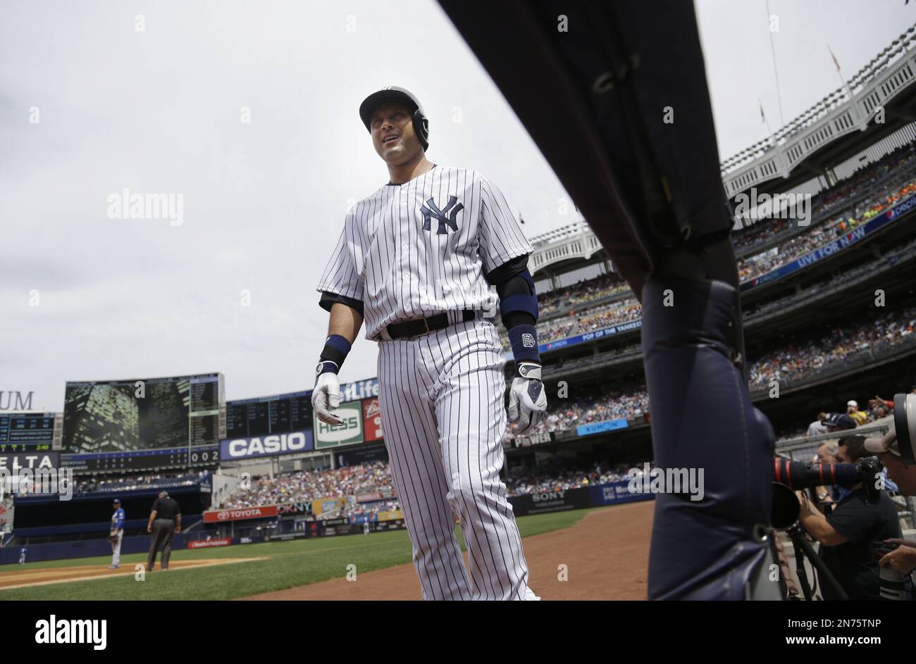 New York Yankees' Derek Jeter returns to the dugout during the fifth ...