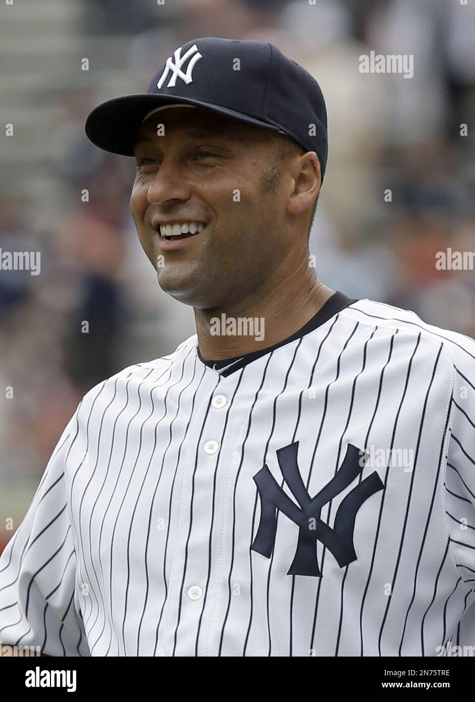 New York Yankees' Derek Jeter warms-up before the baseball game against ...
