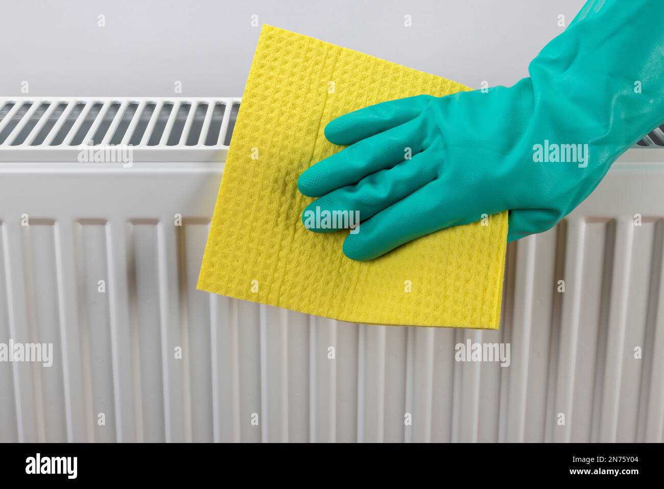 Clean radiator with a sponge cloth outside, white background, symbol ...