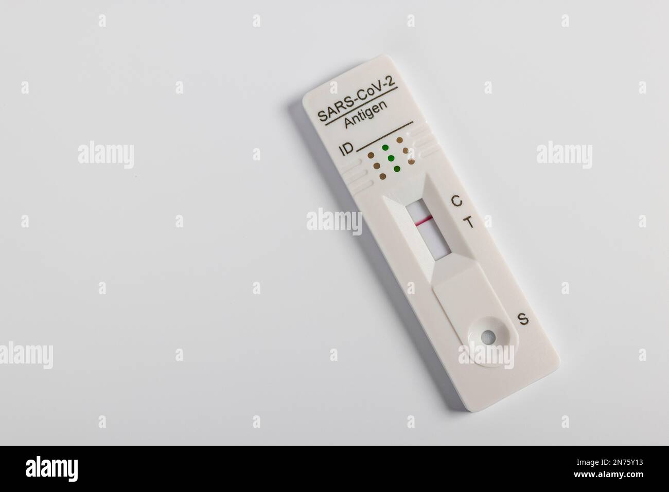 Rapid SARS-CoV-2 Antigen Test Cassette with negative test result, white ...