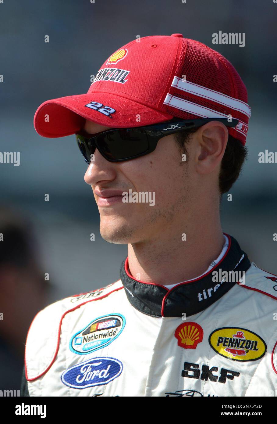 Joey Logano walks on pit road during qualifying for the NASCAR Sprint ...