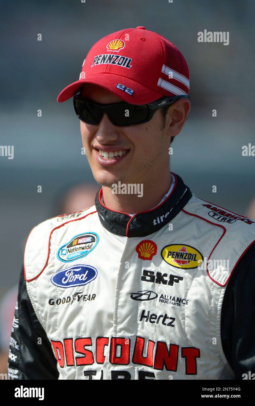 Joey Logano walks on pit road during qualifying for the NASCAR Sprint ...