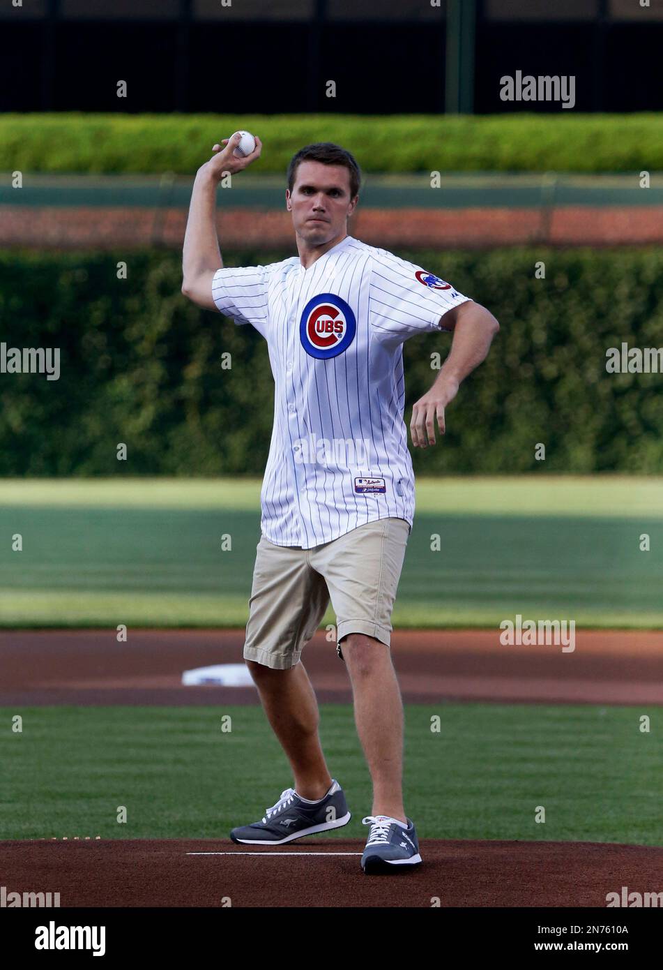 Dan Cline throws out a ceremonial first pitch before an interleague ...