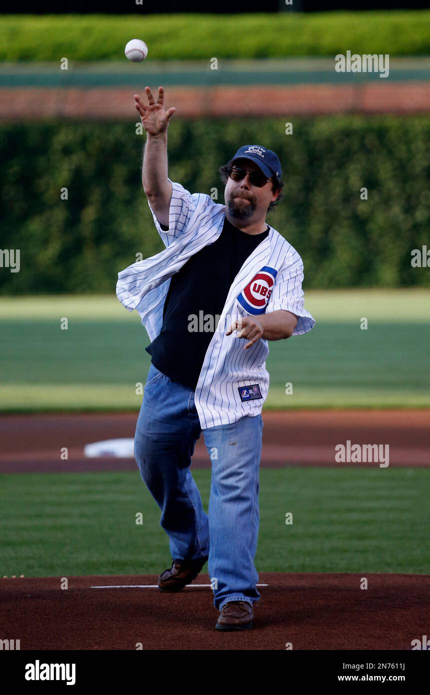 Brian Posen throws out a ceremonial first pitch before an interleague ...