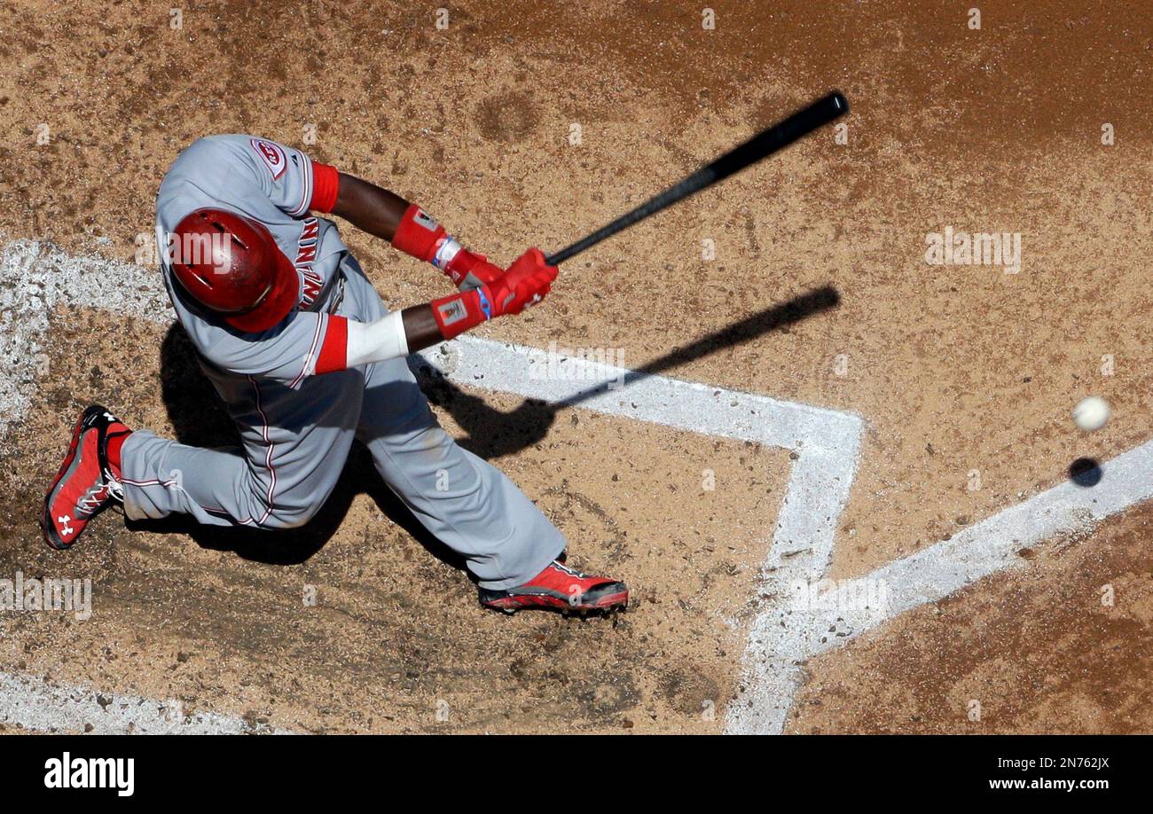 Cincinnati Reds' Brandon Phillips hits an RBI ground ball during the ...
