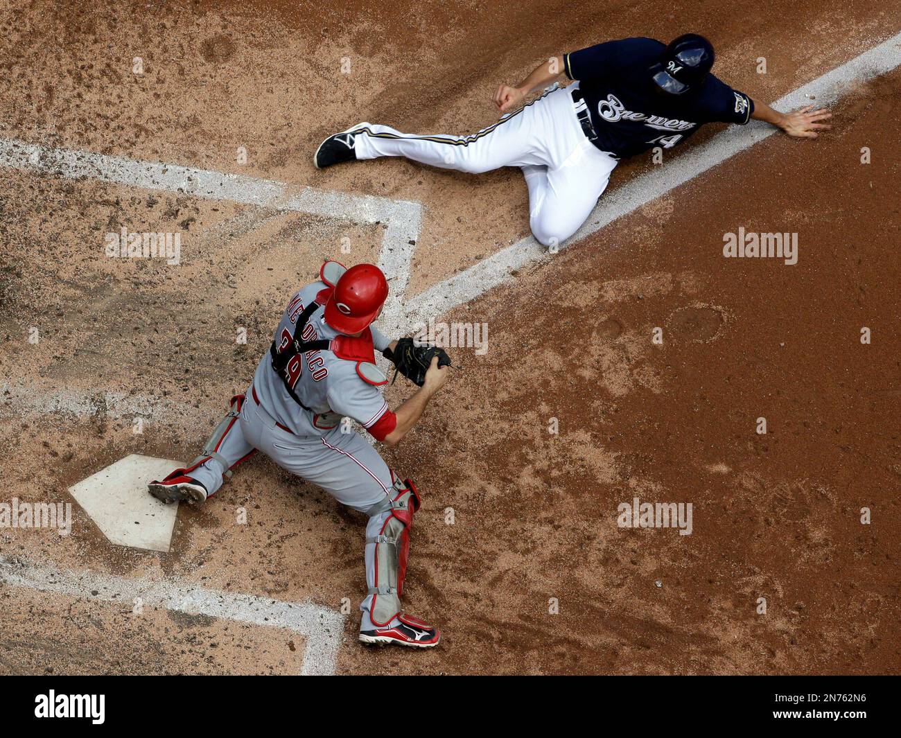 Cincinnati Reds catcher Devin Mesoraco tags out Milwaukee Brewers' Jeff ...