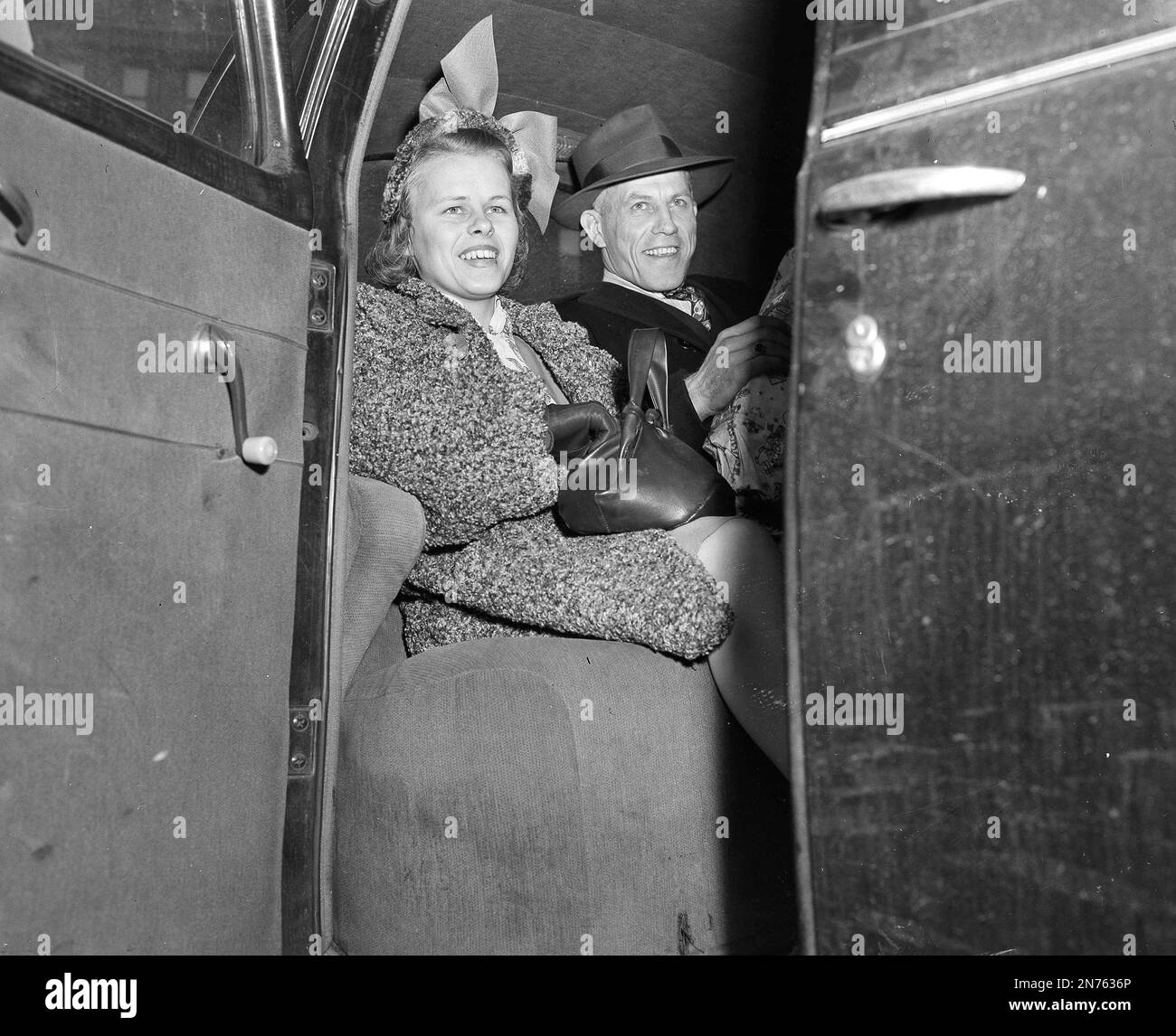 Pearl Lusk, accompanied by Det. Harry Strauss, rides to a police ...