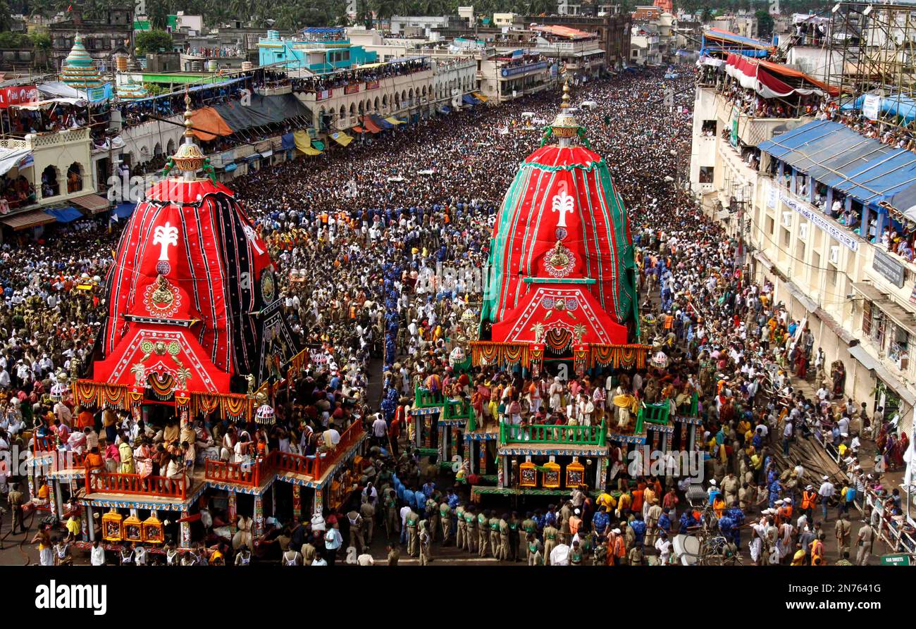 Devotees throng around the chariot of Lord Jagannath and his sister ...