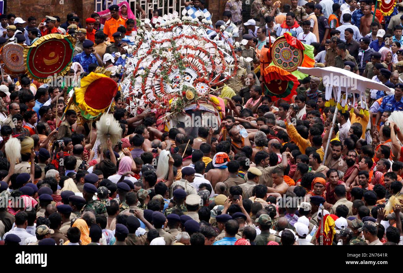 Hindu devotees carry the idol of Lord Jagannath for the Rath Yatra or ...