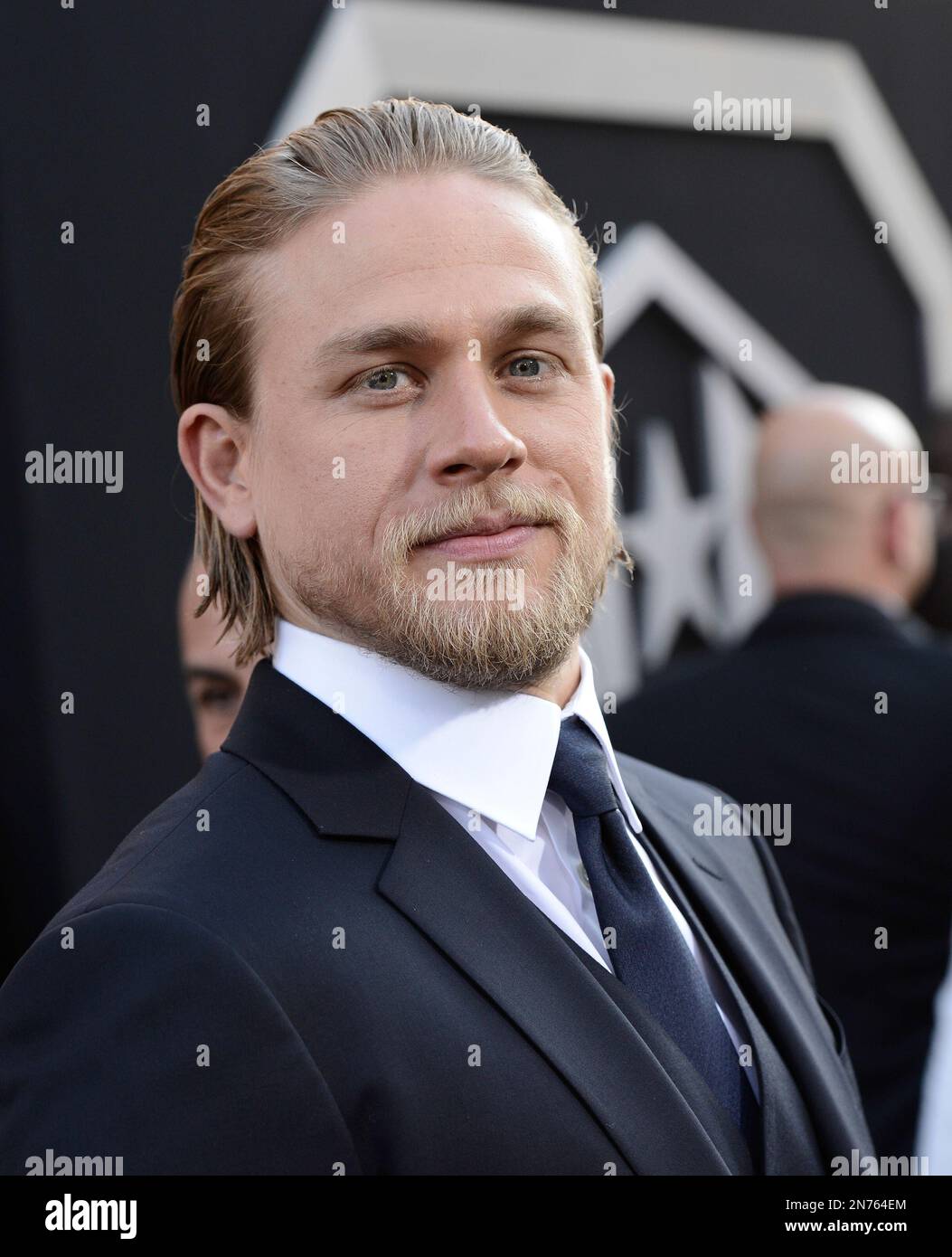 Actor Charlie Hunnam arrives on the red carpet at the LA premiere of ...