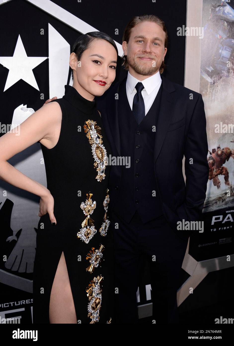 Actor Charlie Hunnam, right, and actress Rinko Kikuchi arrive on the ...